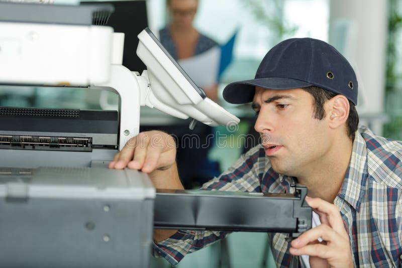 Man Fixing Printing Machine Stock Image - Image of engineering, system ...