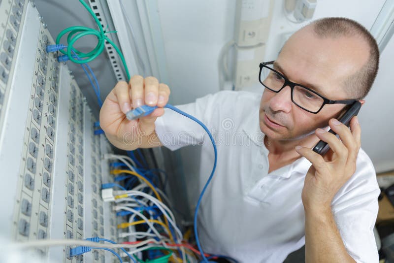 Man Fixing Server Network in Data Center Room Stock Image - Image of ... Man Fixing Server Network in Data Center Room Stock Image - Image of ...