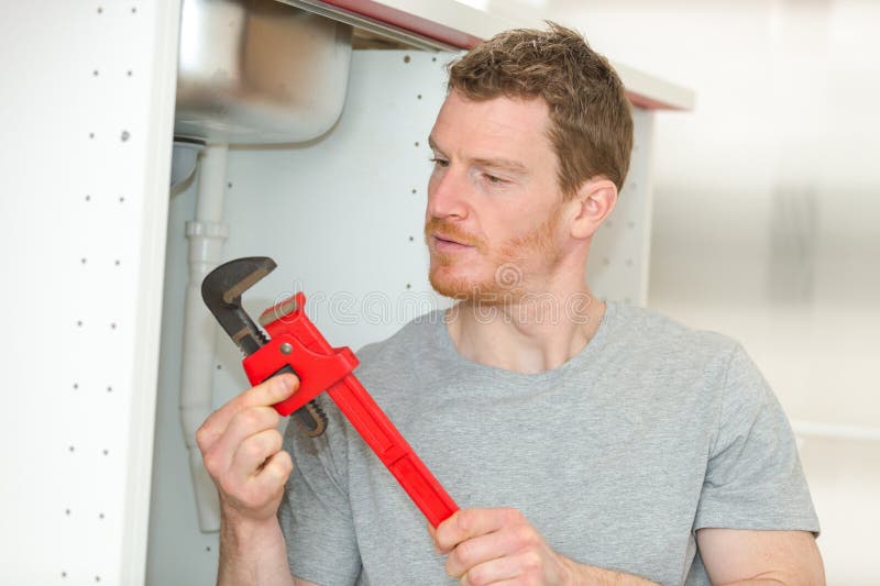 Man Replacing Plumbing Part Under Sink Stock Photo - Image of drain ...