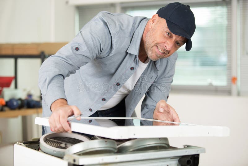 Man Fixing Something in Kitchen Stock Photo - Image of caucasian, hand ...
