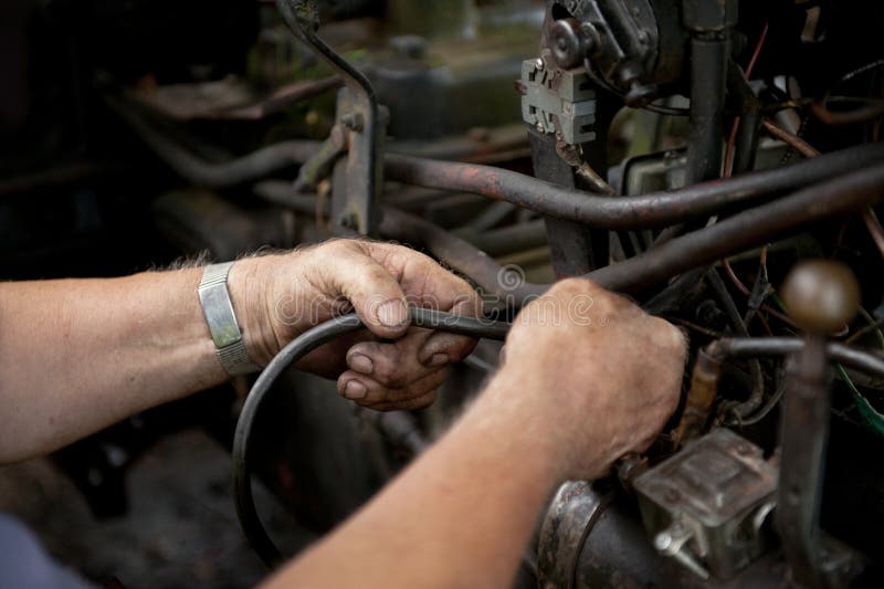 Man fixing tractor machine stock photo. Image of automobile - 28536750