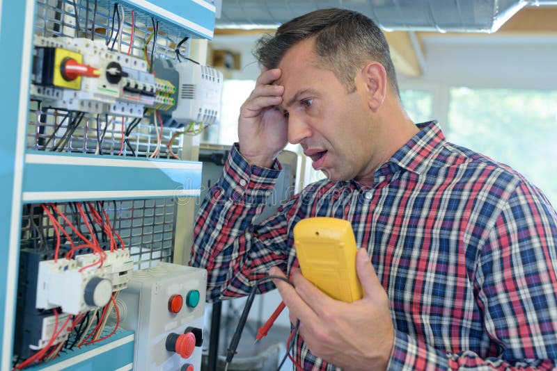 Man fixing voltage problem stock photo. Image of people - 210148162