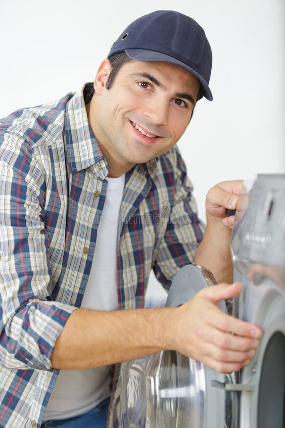 Man fixing washing machine stock image. Image of power - 285685789