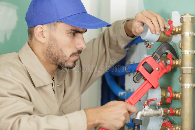 Man fixing water meter stock image. Image of pipes, technology - 301294869