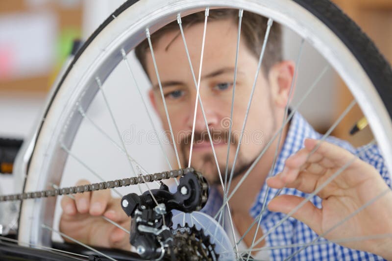 Man Fixing Wheel on Bicycle Stock Image - Image of maintenance, defect ...