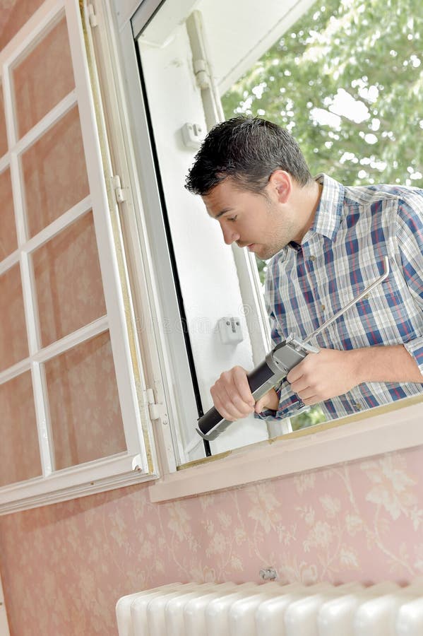 Man fixing window stock image. Image of young, assistance - 319214641