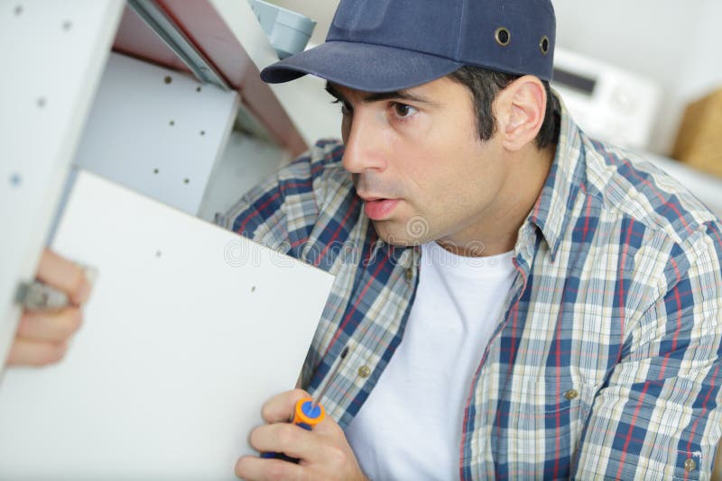 Man Fixing Wood Door Cupboard Stock Photo - Image of male, manual ...