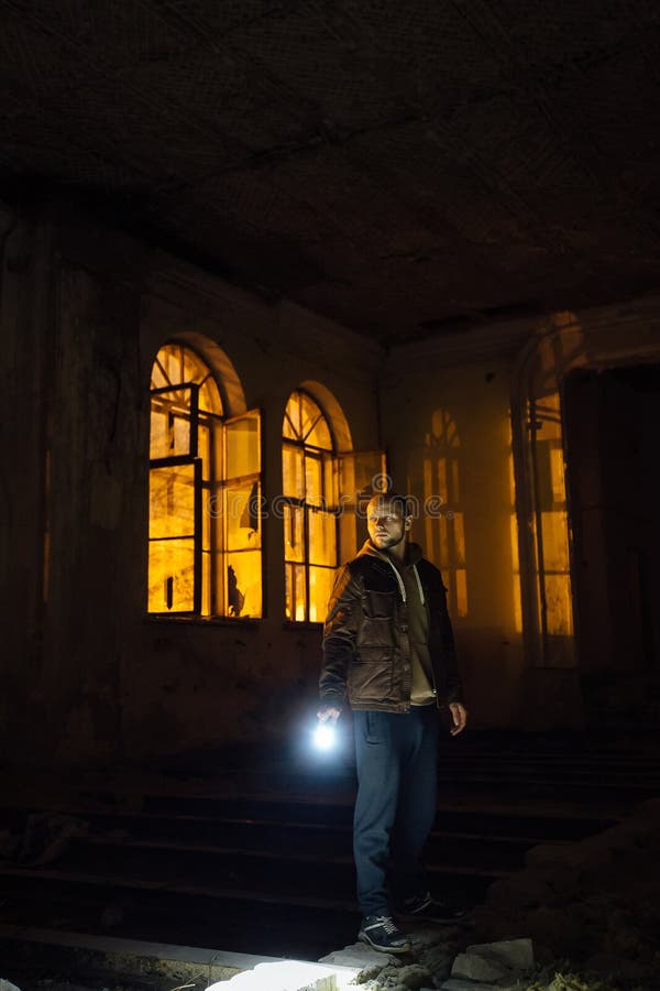 Man with Flashlight in Dark Creepy Abandoned Mansion at Night Stock ...