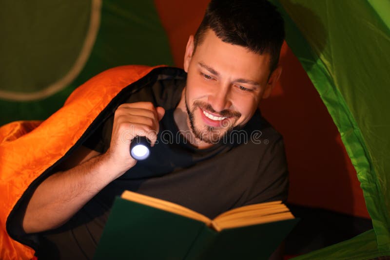 Man with Flashlight Reading Book Stock Photo - Image of activity, hobby ...