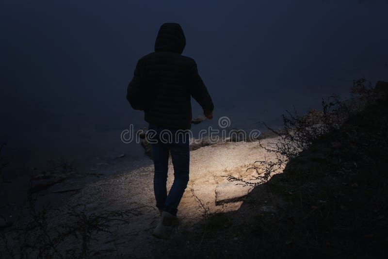 Man with Flashlight Walking Near River Stock Image - Image of hike ...