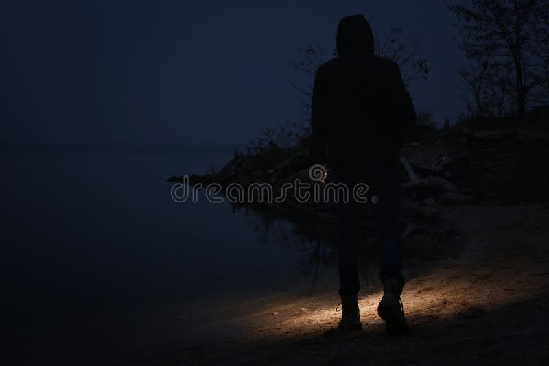 Man with Flashlight Walking Near River Stock Image - Image of hike ...