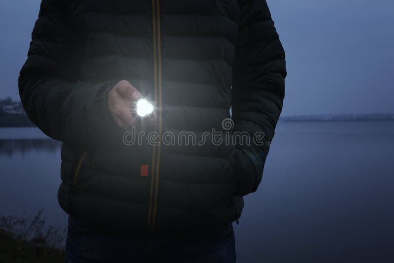 Man with Flashlight Walking Near River Stock Photo - Image of copy ...