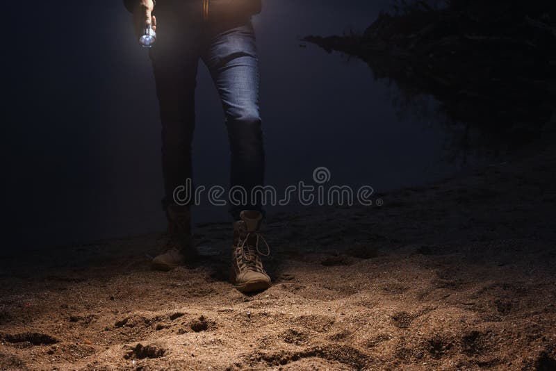 Man with Flashlight Walking Near River Stock Photo - Image of copy ...