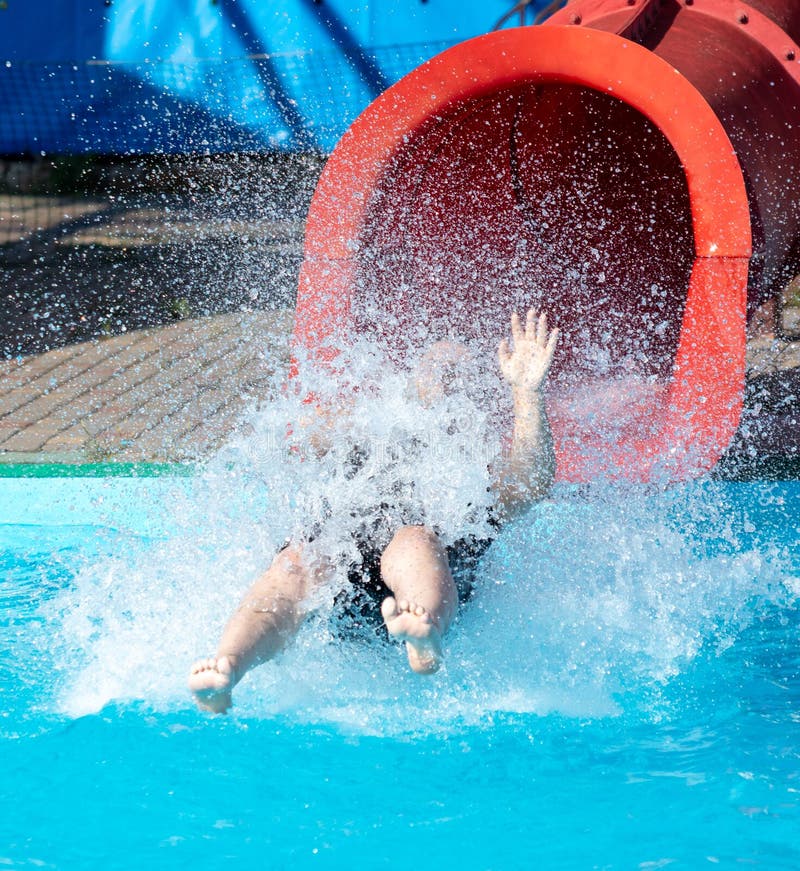 A Man Flies from a Slide into a Swimming Pool Stock Image - Image of ...