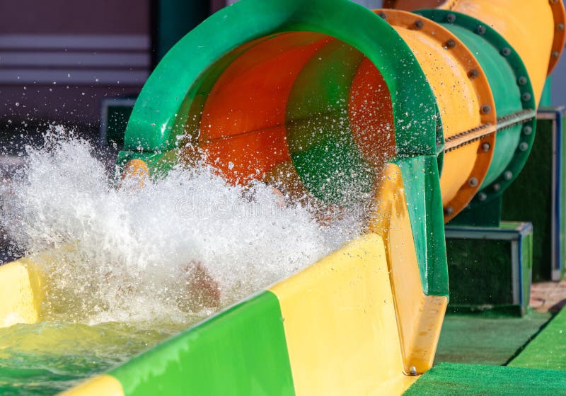 A Man Flies from a Slide into a Swimming Pool Stock Photo - Image of ...