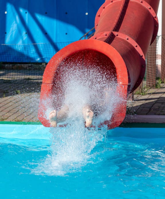 A Man Flies from a Slide into a Swimming Pool Stock Photo - Image of ...