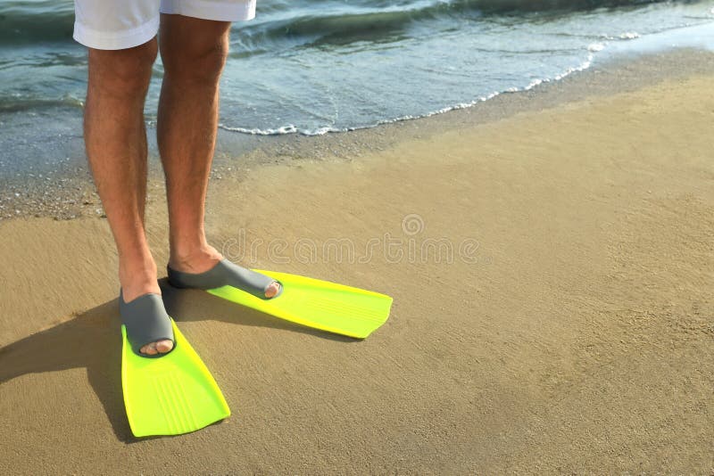 Man in Flippers on Sandy Beach, Closeup Stock Photo - Image of fins ...