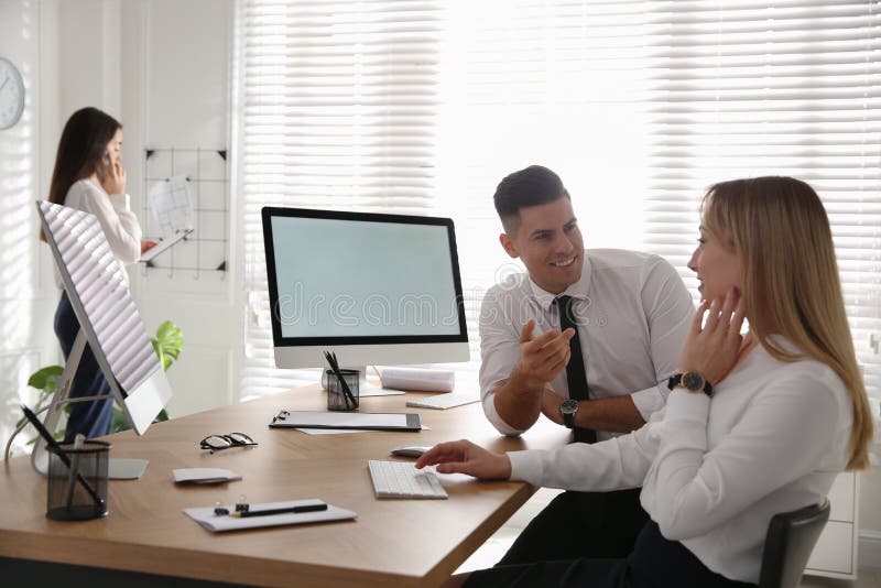 Man Flirting with His Colleague during Work in Office Stock Photo ...