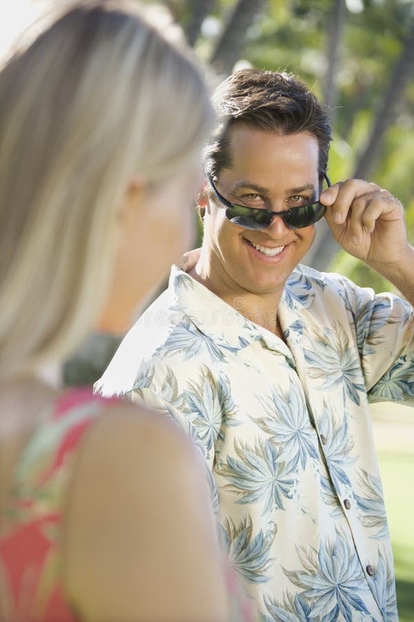 Man flirting with woman. stock photo. Image of blond, sunglasses - 2425074