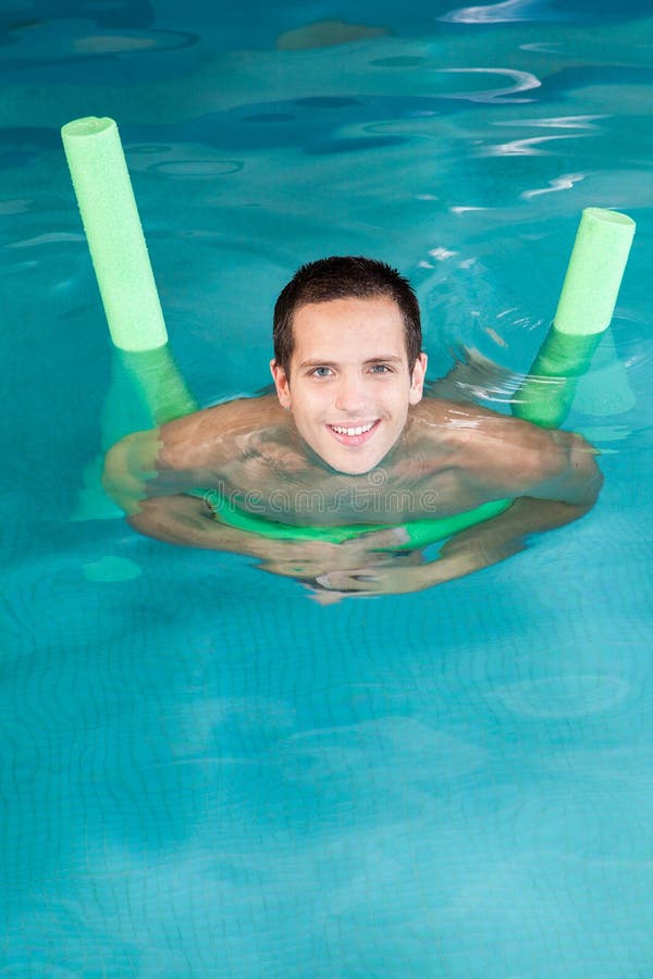 Man floating in the pool stock image. Image of break - 49997563