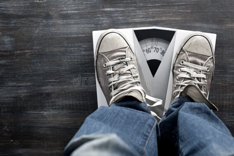 Man on floor scale stock photo. Image of mass, dieting - 52055088