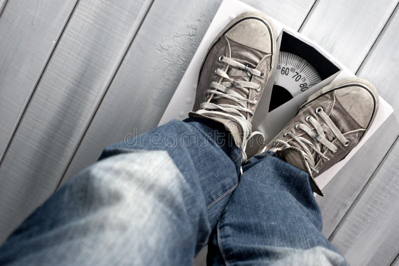 Man on floor scale stock photo. Image of balance, care - 52056026