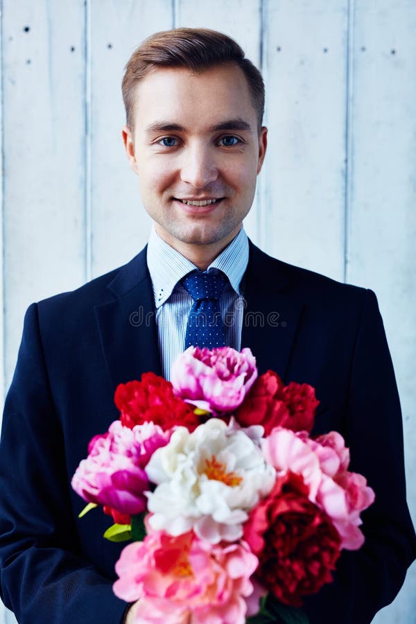 Man with flowers stock photo. Image of event, smiling - 65655312