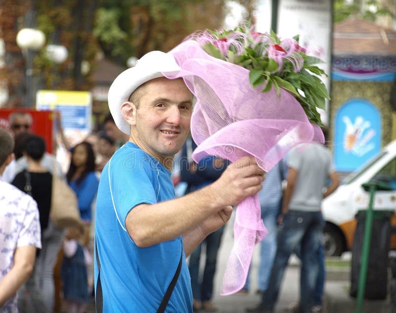 Man with flowers editorial photography. Image of service - 108336822