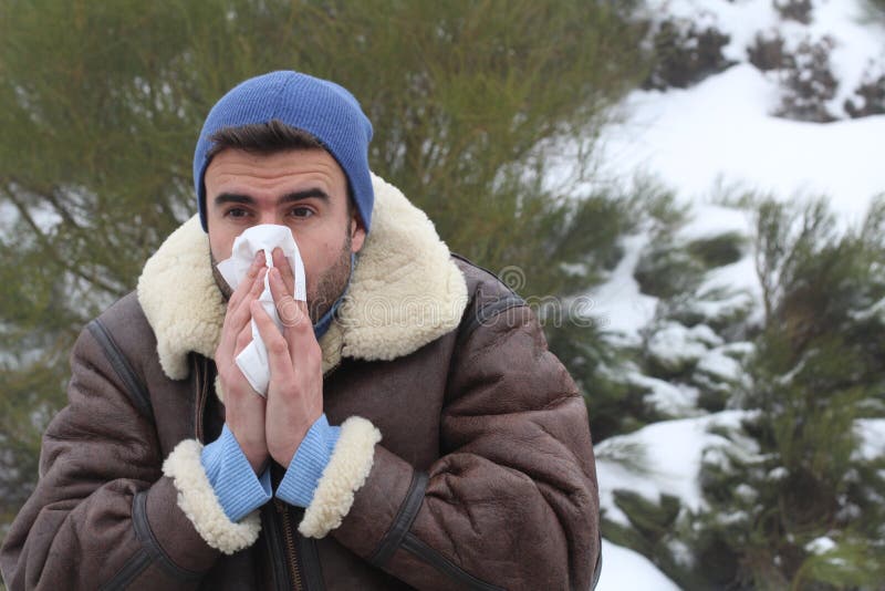 Man with the flu outdoors stock photo. Image of nose - 99231452