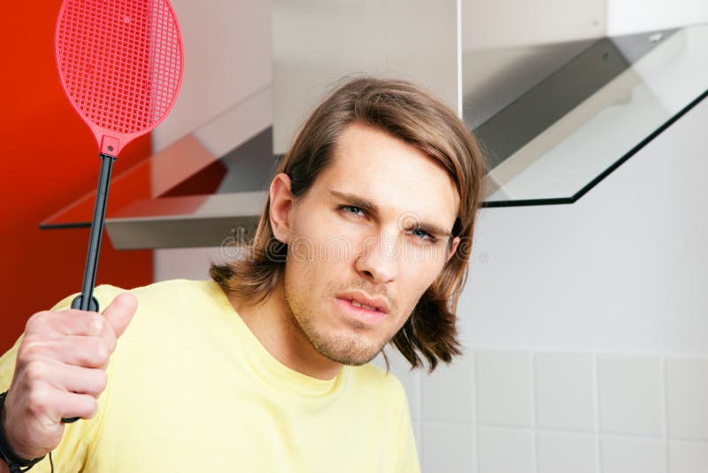 Man with a fly swat stock photo. Image of person, appartment - 12399512