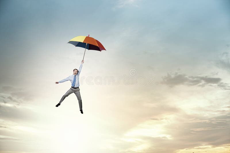 Man fly on umbrella stock image. Image of city, action - 58546179