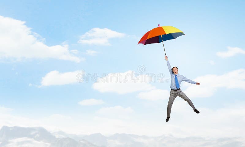 Man fly on umbrella stock photo. Image of city, environment - 59196680