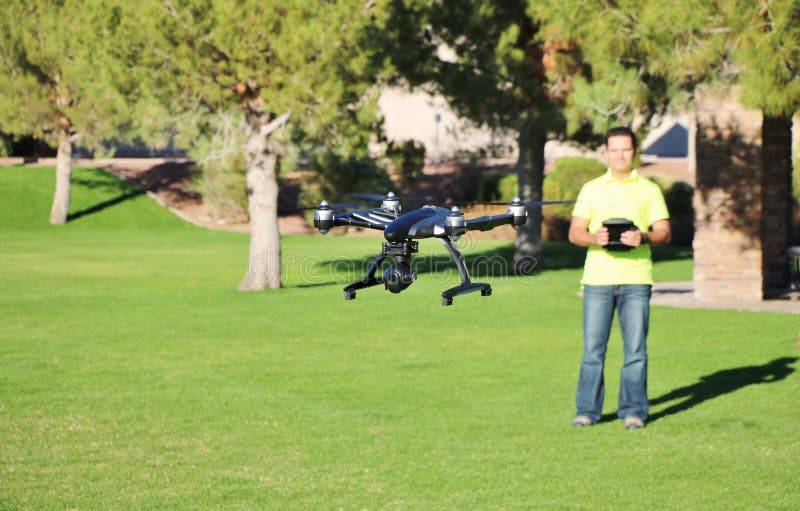 Man Flying a Camera Drone (LARGE FILE) Stock Image - Image of aerial ...
