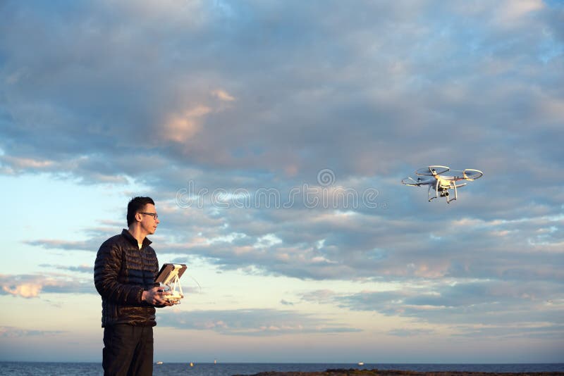 Man Flying Drone with Remote Control at the Beach Stock Image - Image ...