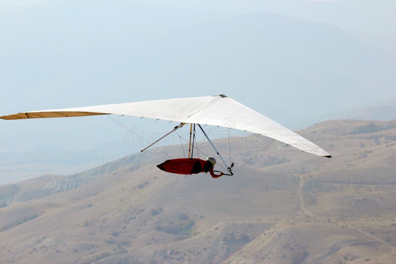 Man Flying on a Hang Glider Stock Image - Image of adrenaline, leisure ...