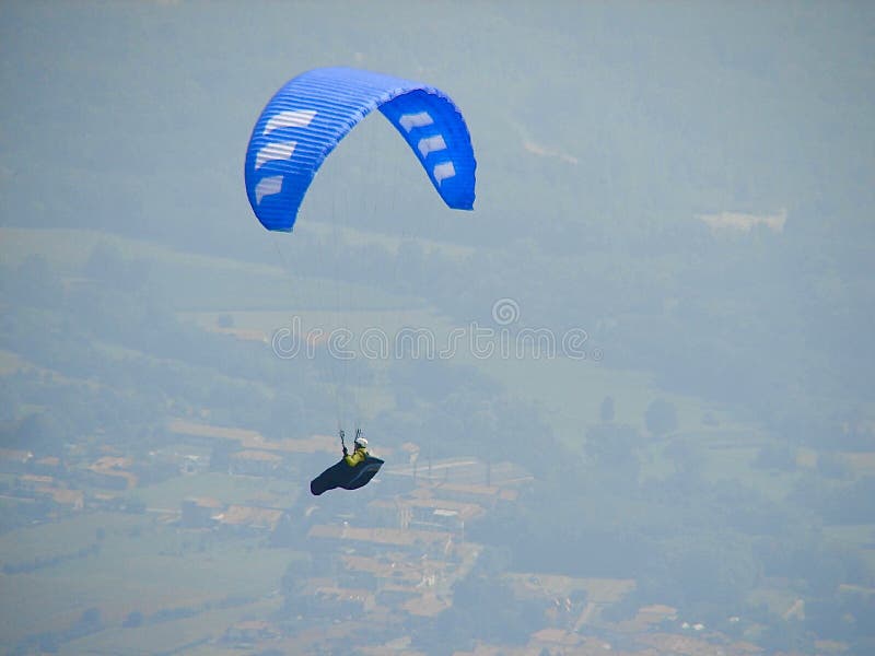 Man flying with parachute editorial photography. Image of parachuting ...