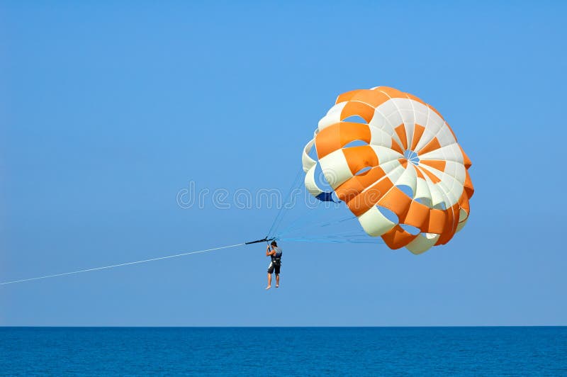 Man Flying Parasailing in a Blue Sky Editorial Stock Image - Image of ...