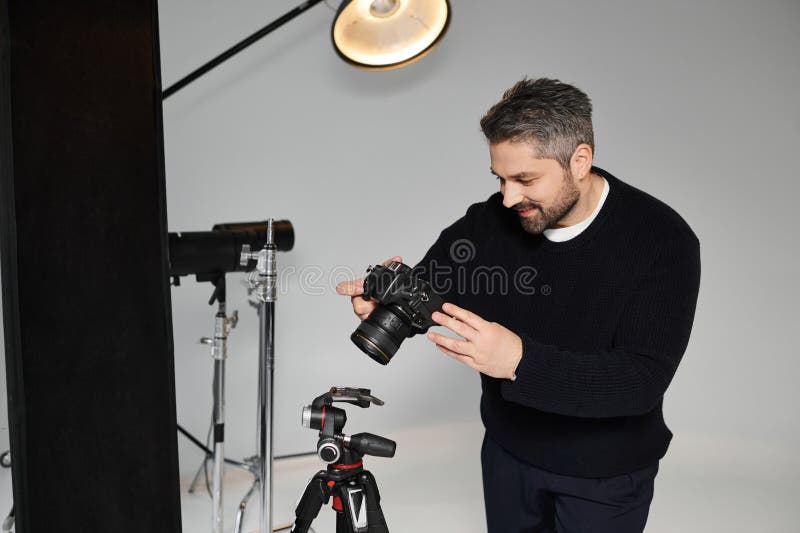 A Man is Focused on Adjusting Stock Image - Image of lighting, ambiance ...