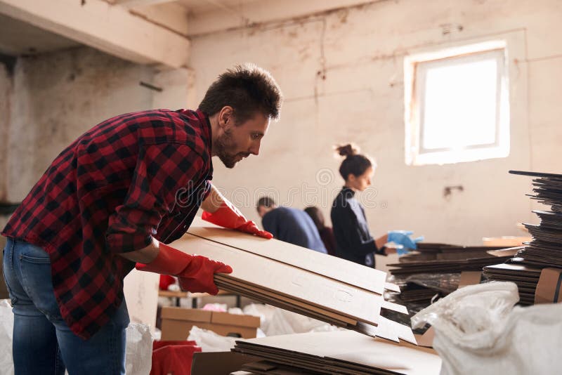 Man Folding the Pressed Cardboard Stock Image - Image of large ...