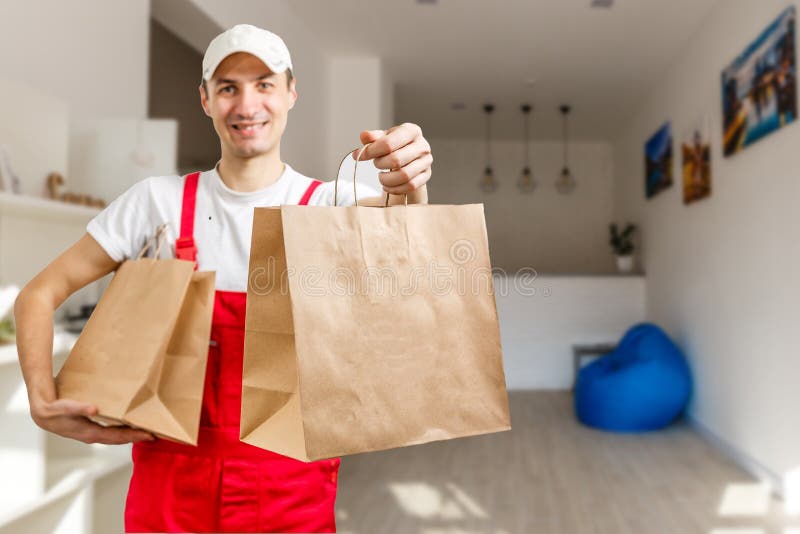Man with Food Delivery Package with Packages on His Head Stock Photo ...