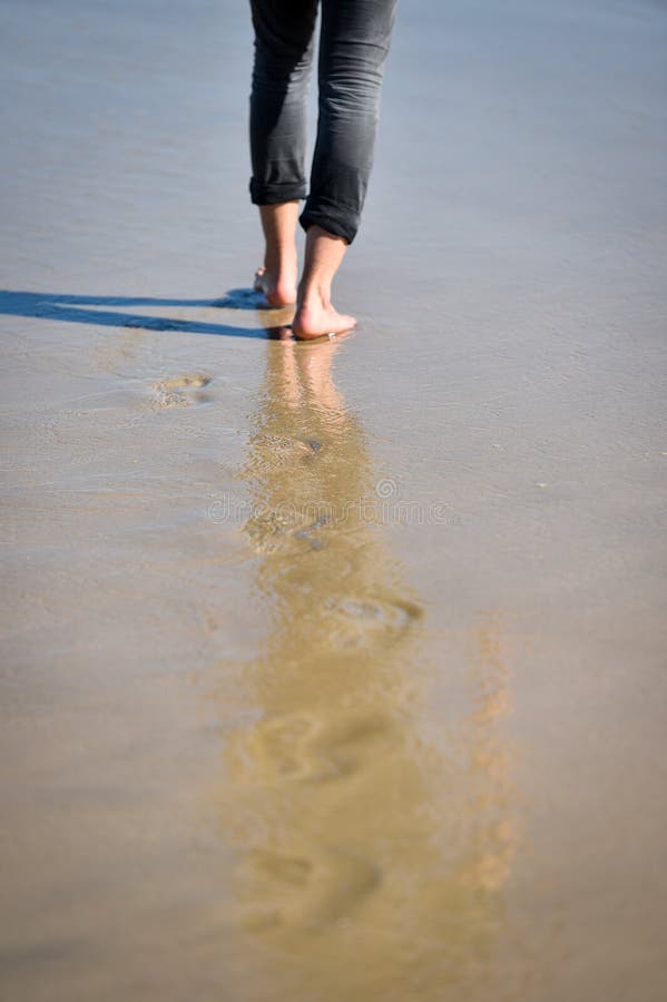 Man Footprints in the Sand on a Beach Stock Photo - Image of people ...