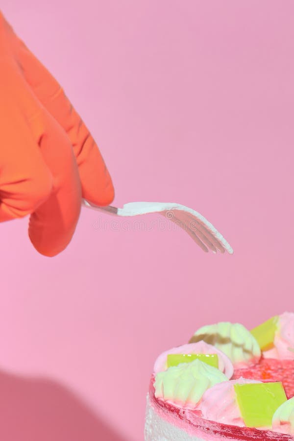 A Man with a Fork in His Hand Reaches for the Cake. Pink Background ...