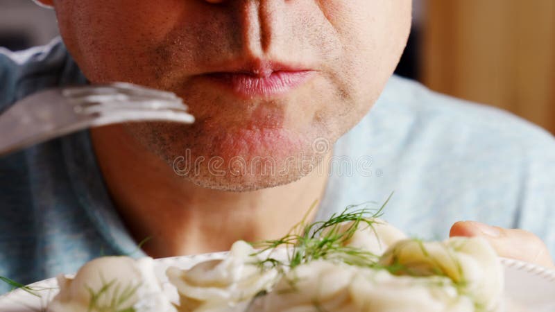 Man with Fork Takes and Eats Dumplings from the Plate Stock Video ...