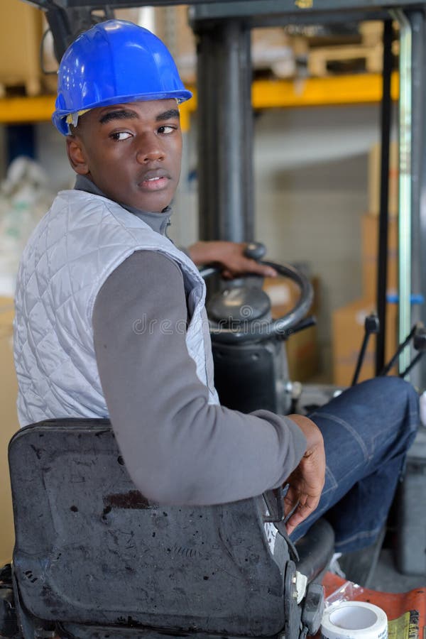 Man on Forklift Loading Boxes at Warehouse Stock Photo - Image of ...
