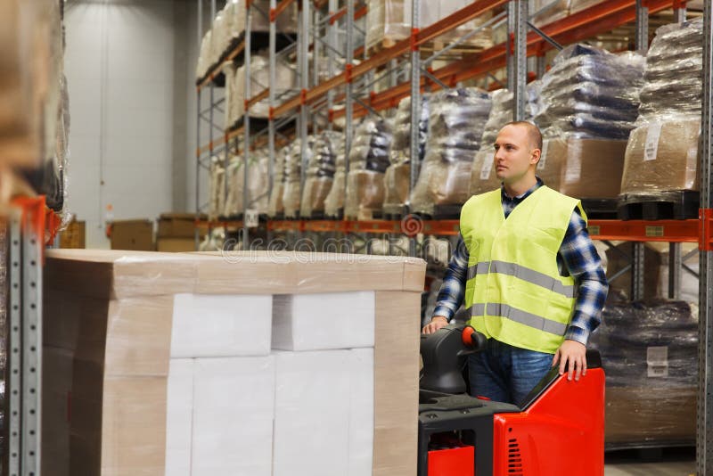 Man on Forklift Loading Cargo at Warehouse Stock Photo - Image of ...