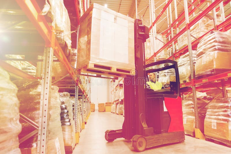 Man on Forklift Loading Cargo at Warehouse Stock Photo - Image of ...