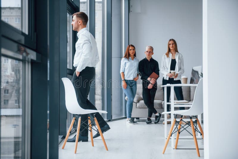 Man in Formal Clothes Walking and Talking. Group of Young Successful ...