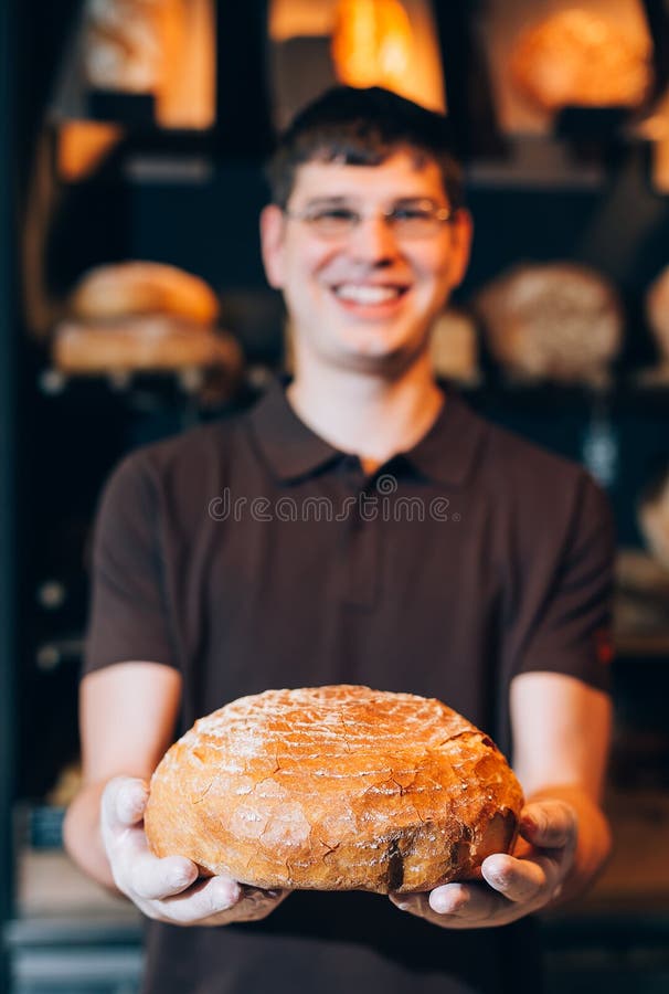 Salesman in a bakery stock photo. Image of sale, eating - 62349456