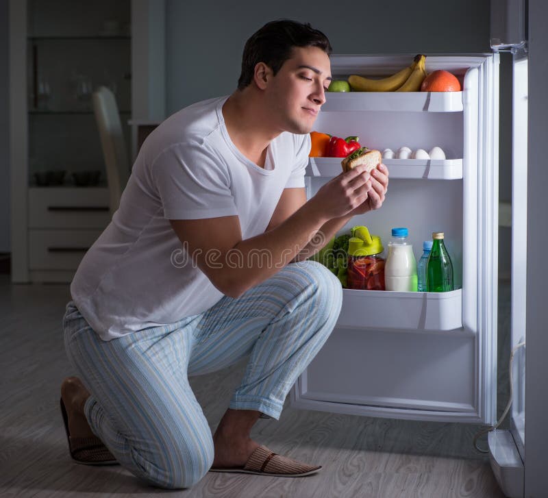 The Man at the Fridge Eating at Night Stock Photo - Image of hungry ...