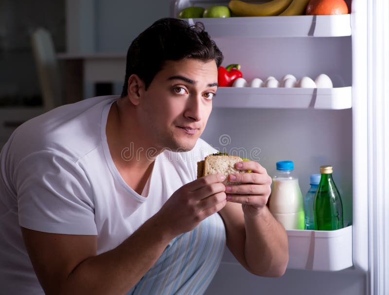 Man at the Fridge Eating at Night Stock Image - Image of fridge ...